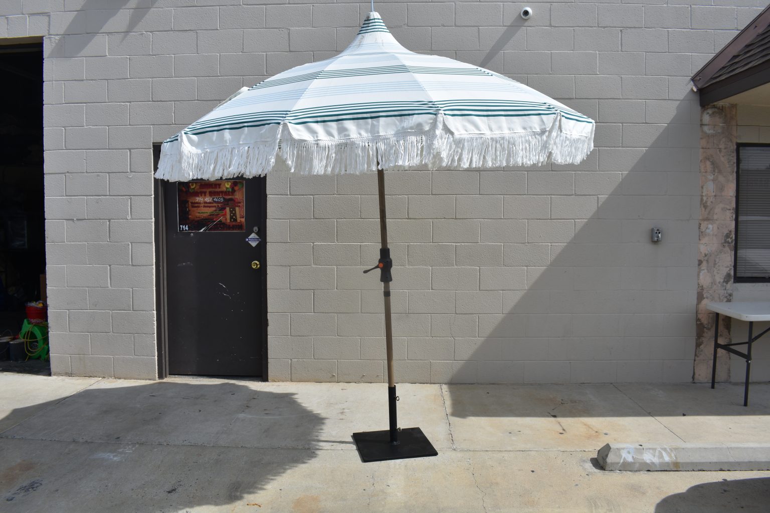 Umbrella with Stand – Welcome Ashley Party Rental's website